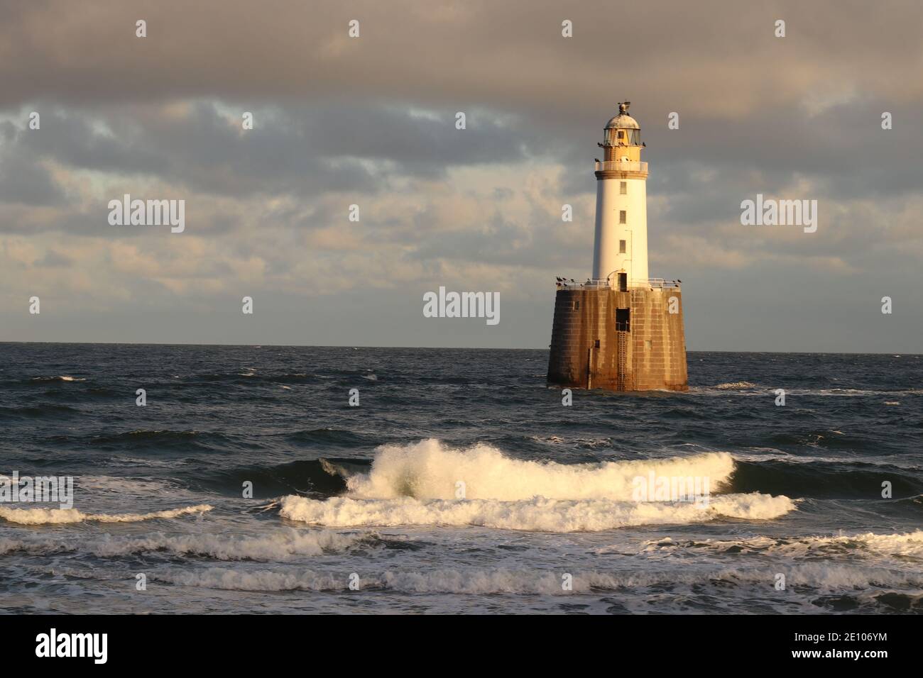 White lighthouse in sea Stock Photo - Alamy