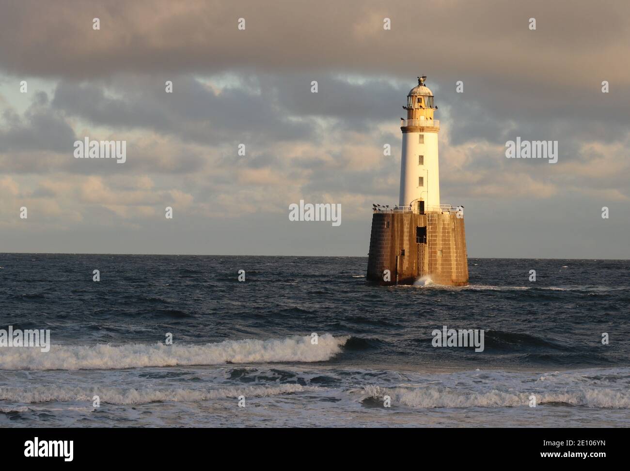 White lighthouse in sea Stock Photo - Alamy