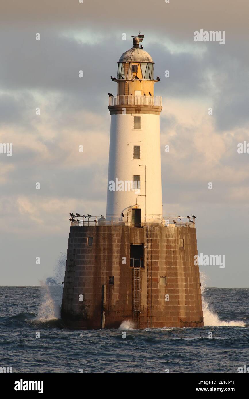 White lighthouse in sea Stock Photo - Alamy