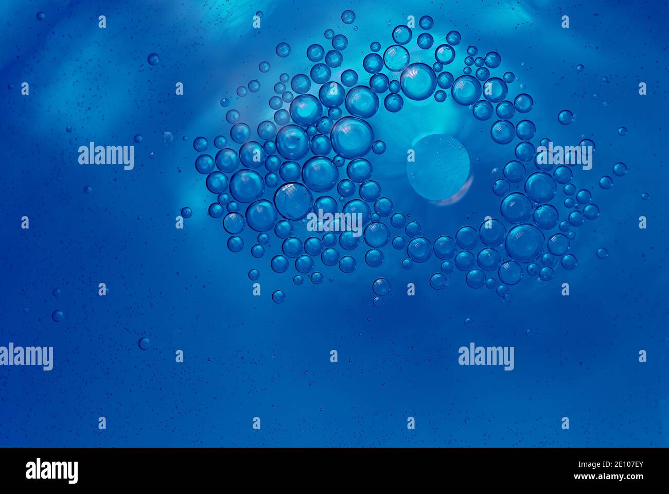 fat on the liquid surface in the blue water Stock Photo - Alamy