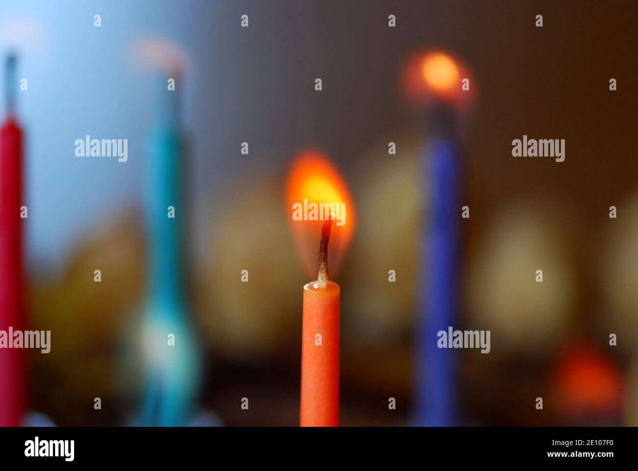 colorful candles with flame at a birthday party Stock Photo - Alamy