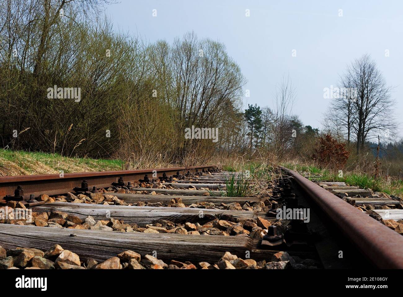 old rusty rails in the landscape Stock Photo - Alamy