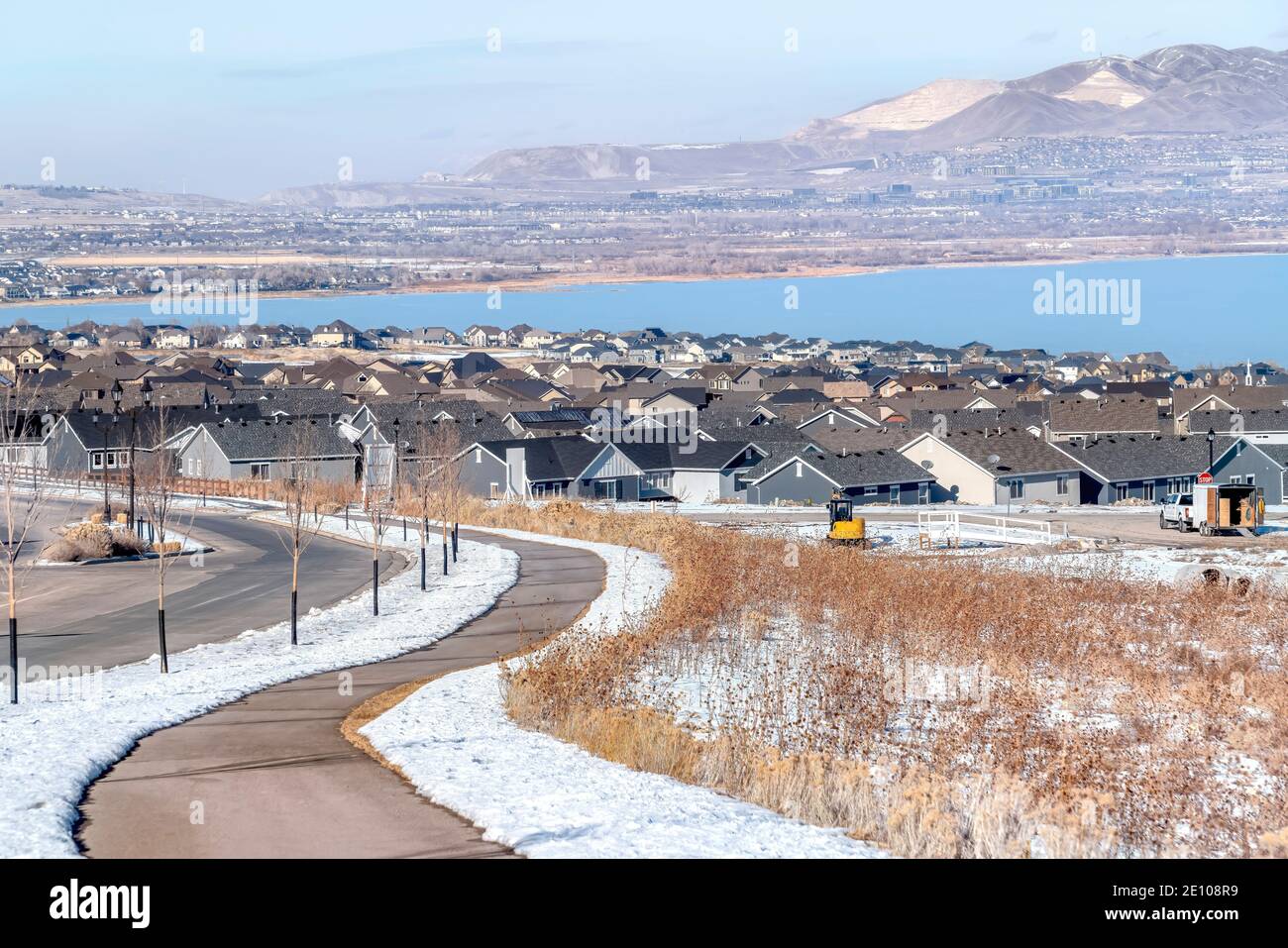 Roads and homes in peaceful neighborhood with scenic views of mountain ...