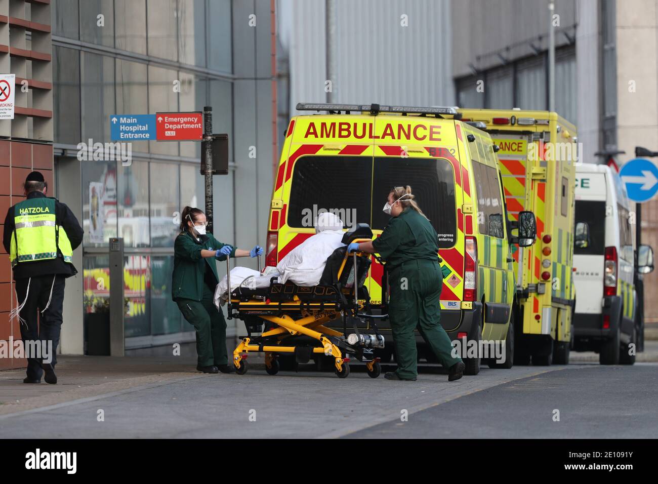 PATIENT'S FACE PIXELLATED BY PA PICTURE DESK An ambulance drops off a ...