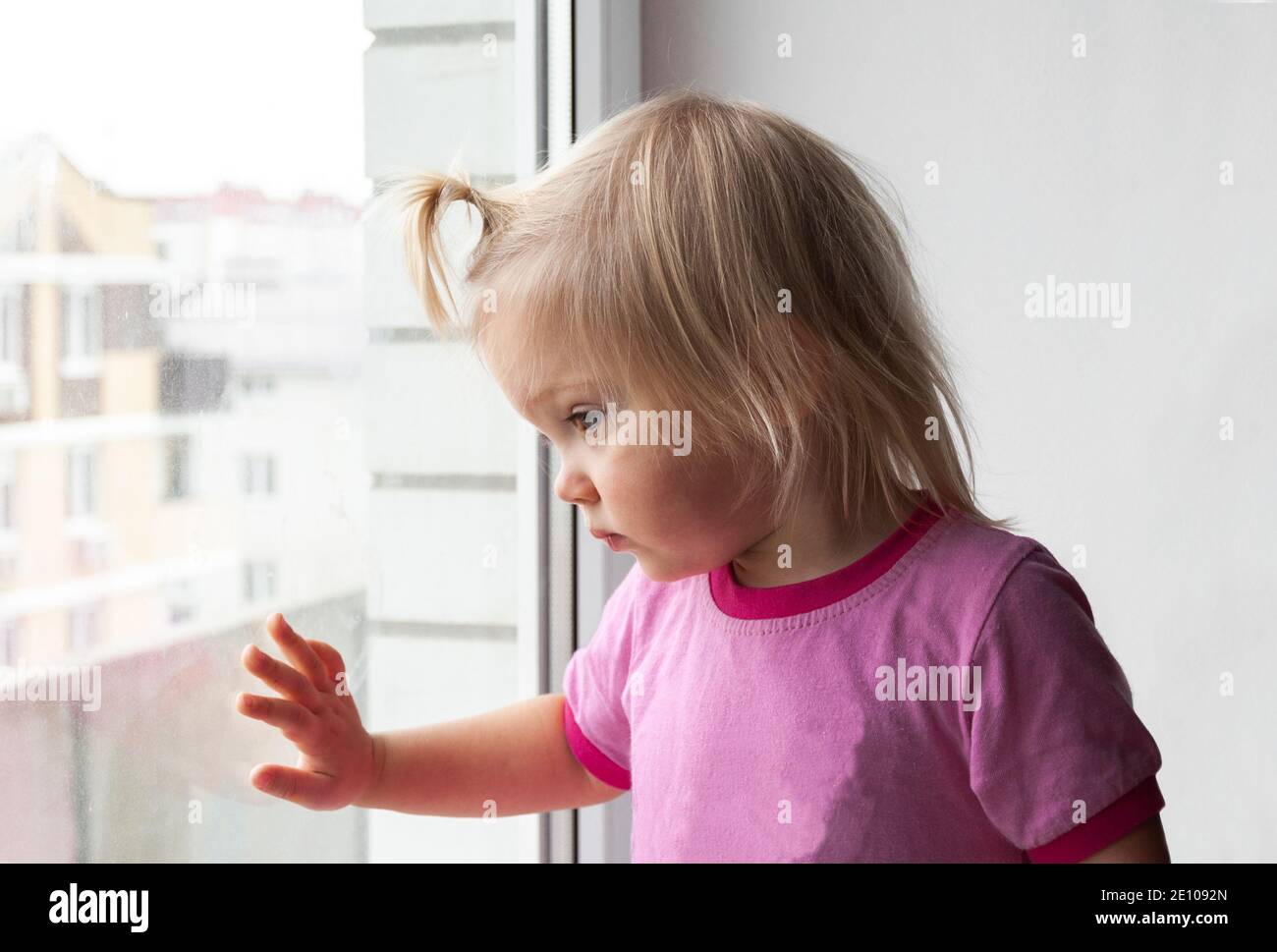 child looks out the window, selective focus Stock Photo - Alamy