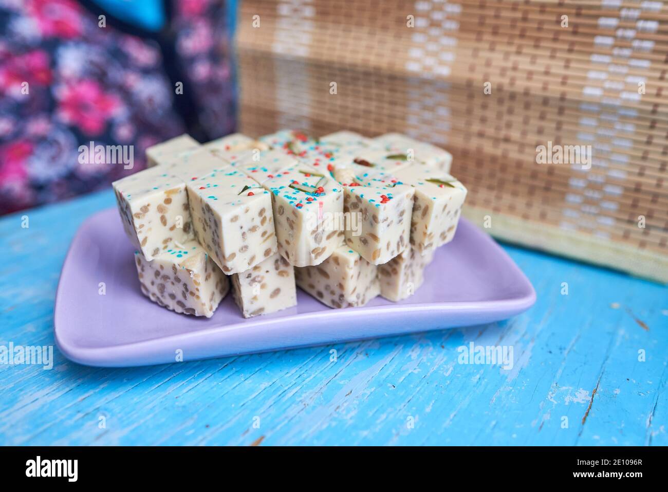 Samarkand halva cut into rhombuses with pistachios and cashews and blue ...