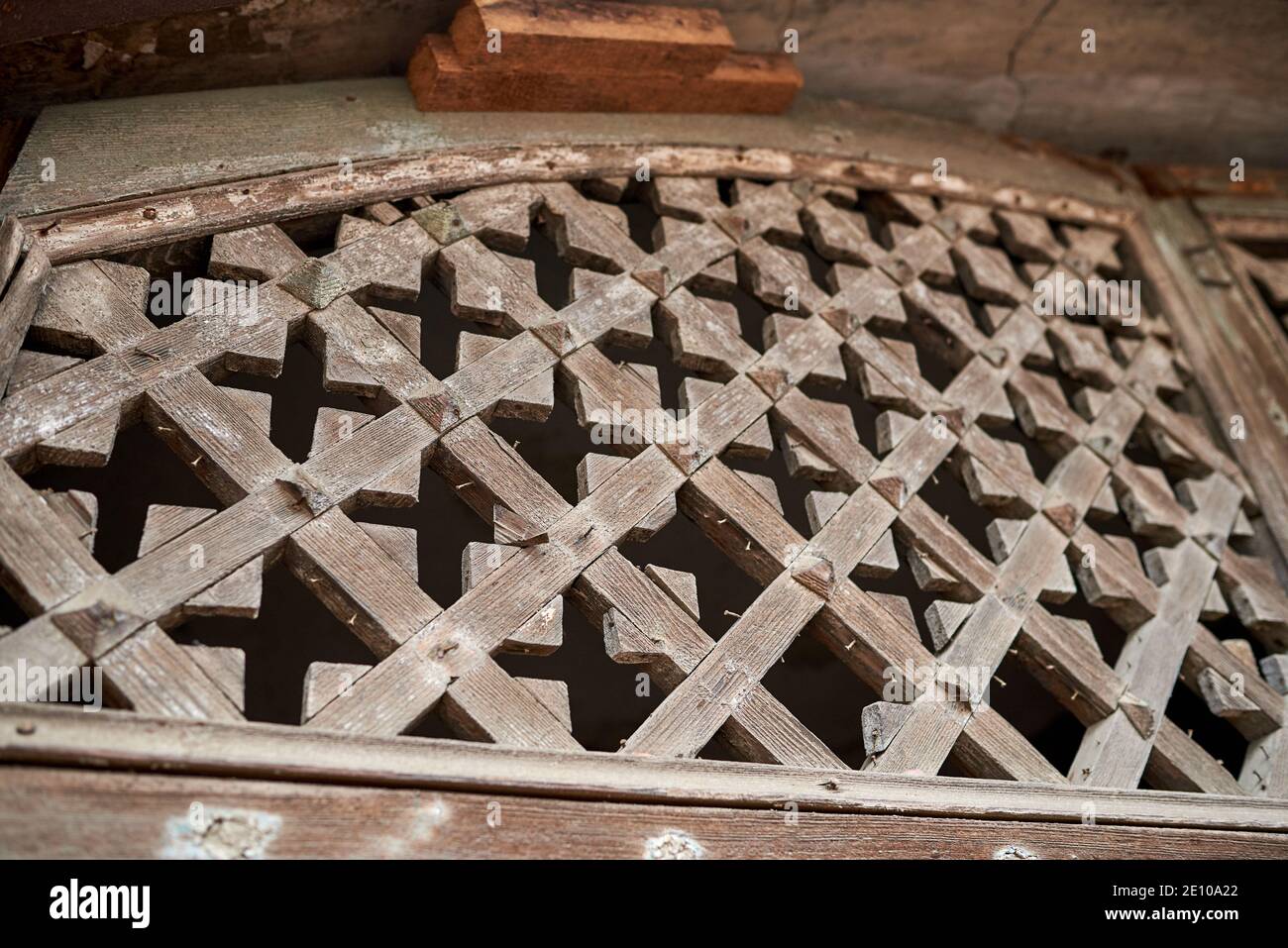 Cross-shaped grid on the top of antique wooden gates Stock Photo - Alamy
