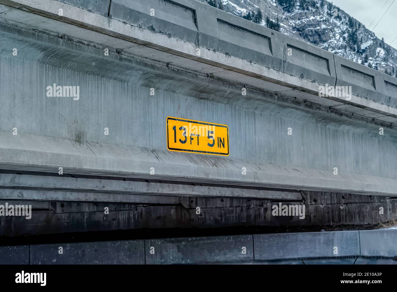 Close up view of a vertical clearance sign at the side of a concrete ...