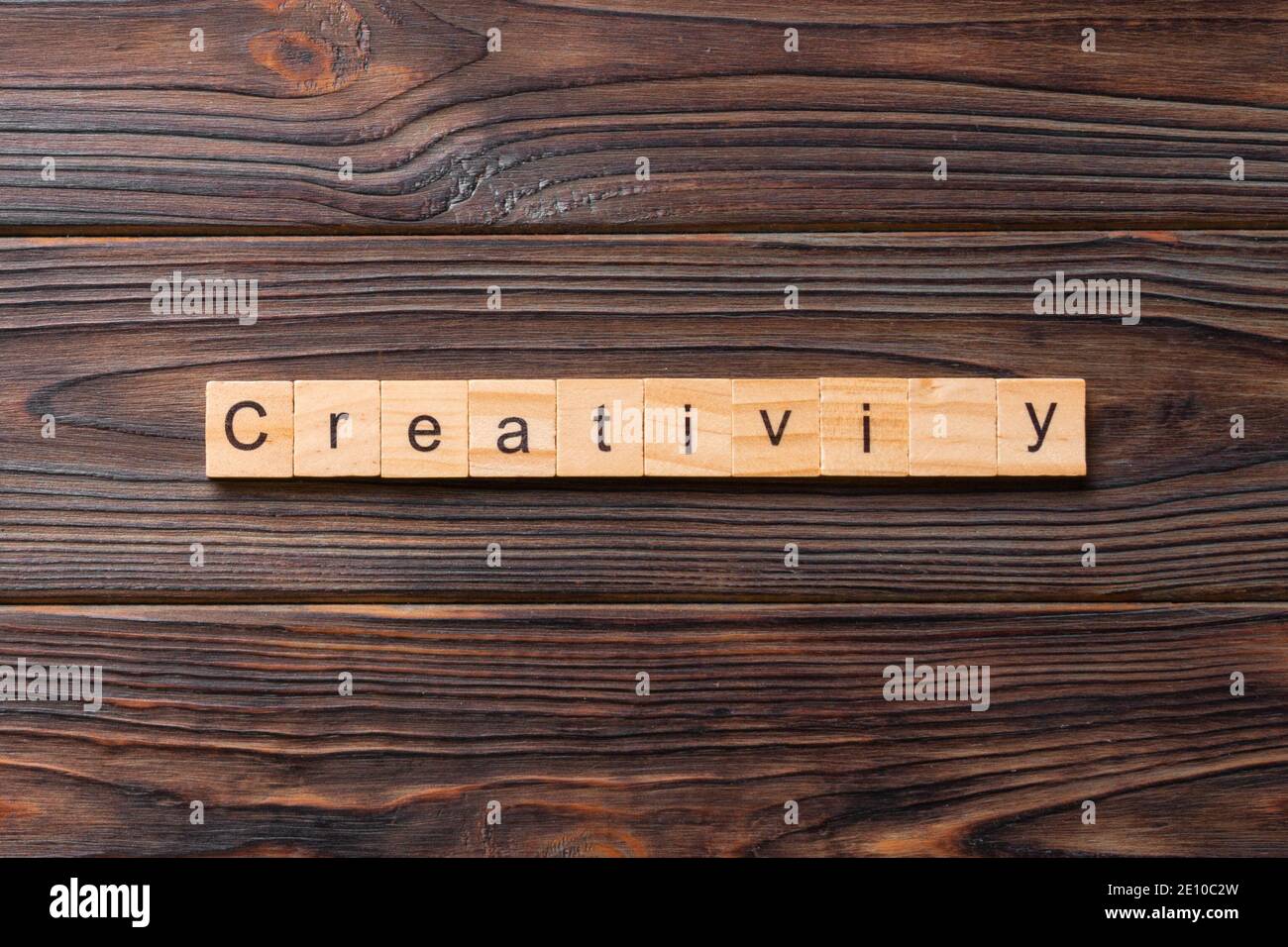 creativity word written on wood block. creativity text on cement table ...