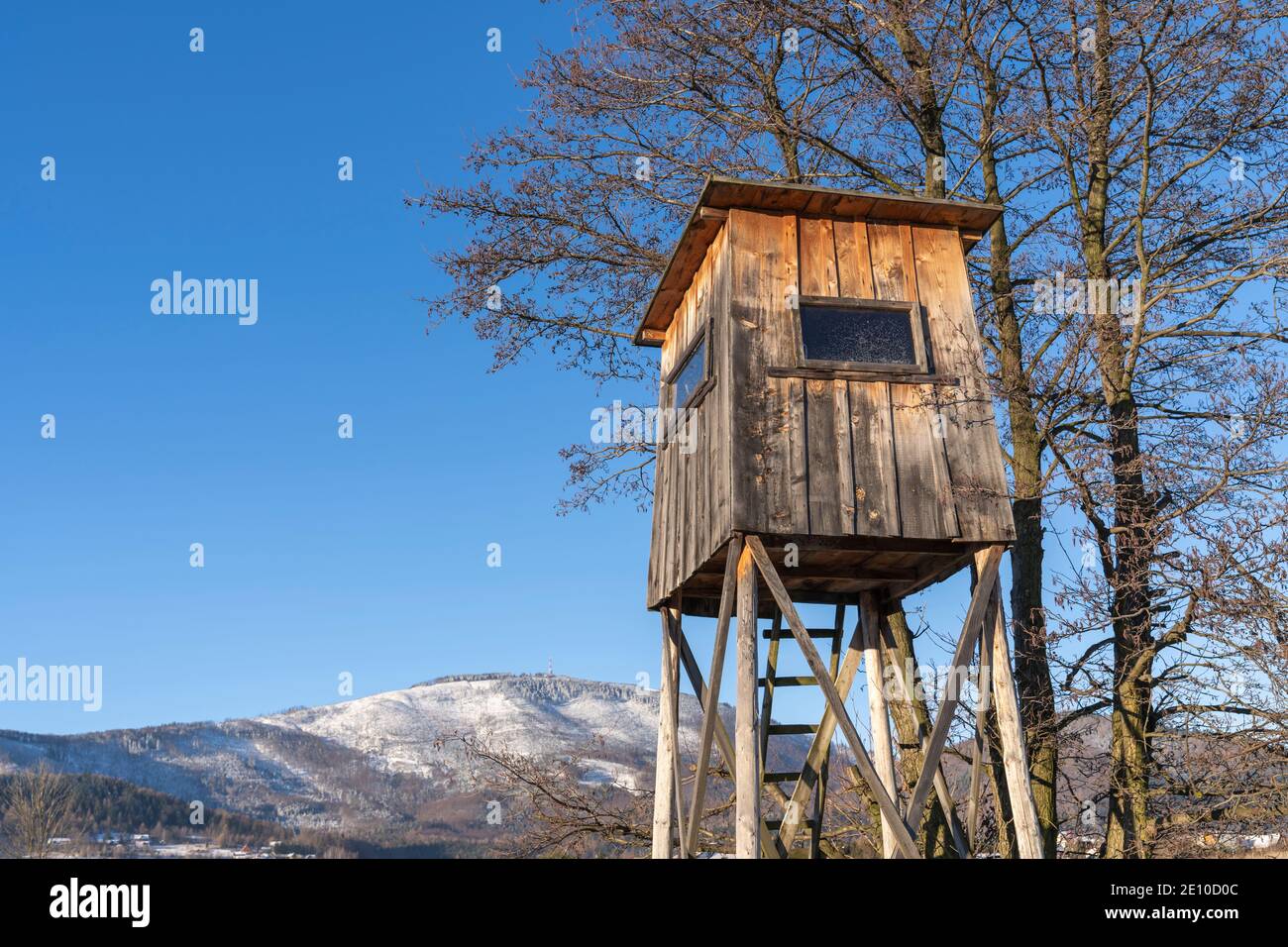 Wooden tower for hunters in the fields in the mountains Stock Photo - Alamy