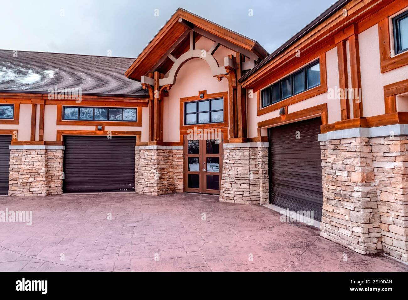 Park pavilion with double glass door entrance and shutter doors at the ...