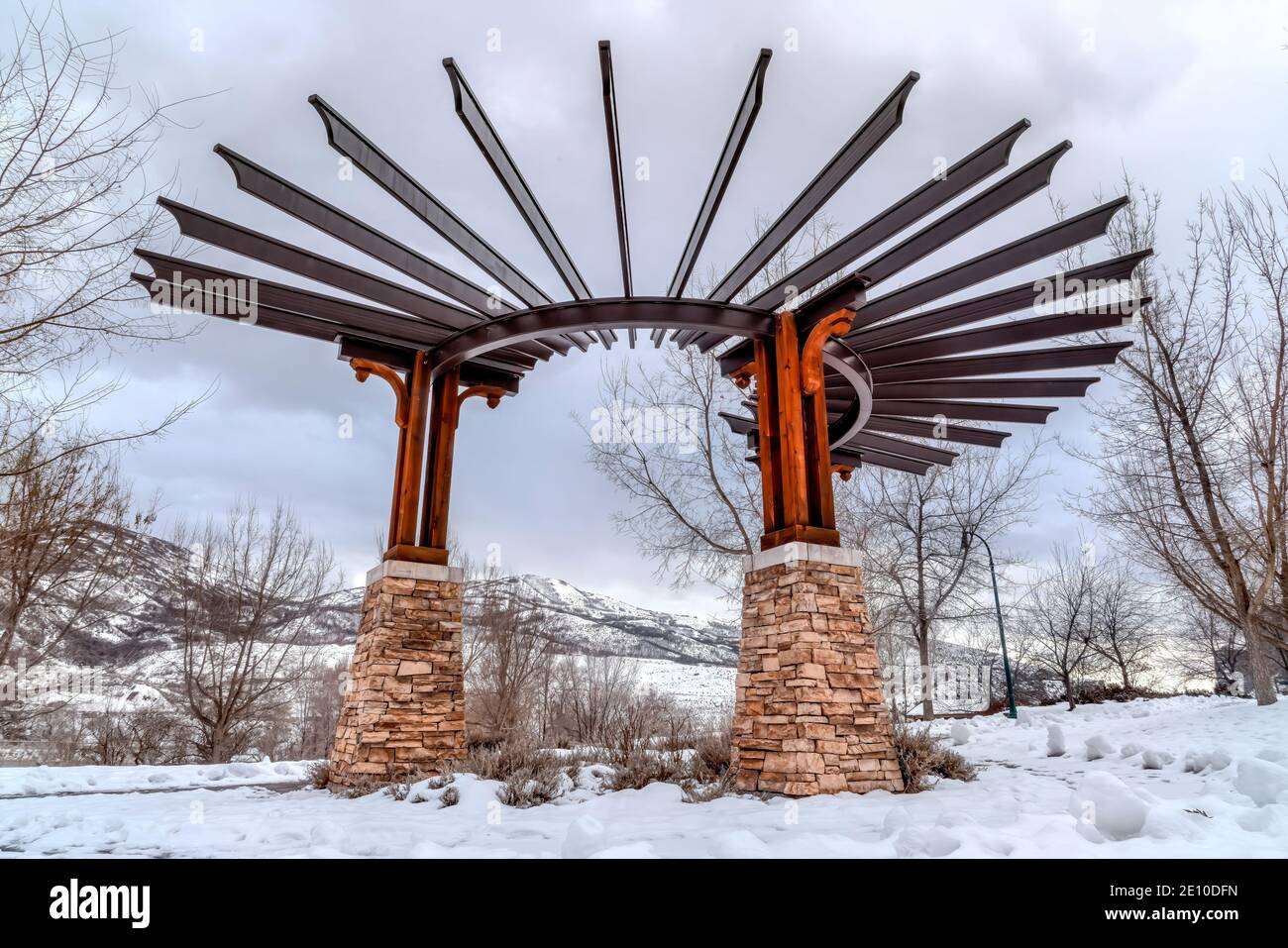 Outdoor architectural structure with radial beams supported by two ...