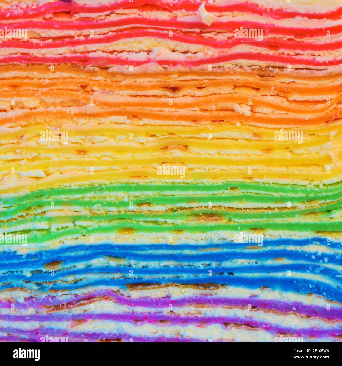 Multicolored rainbow cake. A bright colorful cake made of crepes of ...