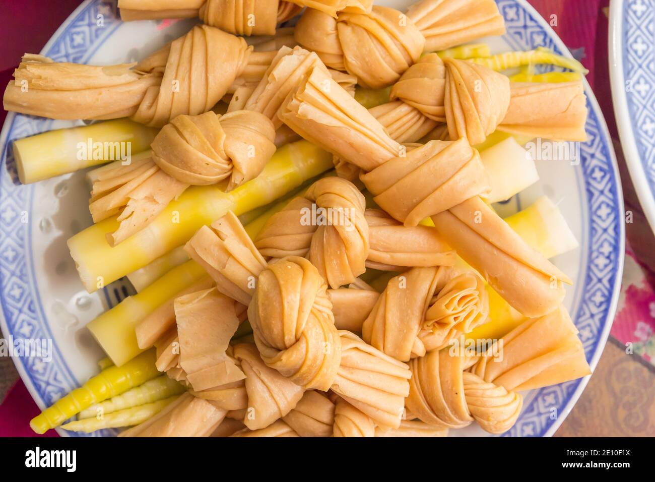 Tofu tied in a knot with bamboo root on a chinese plate Stock Photo - Alamy