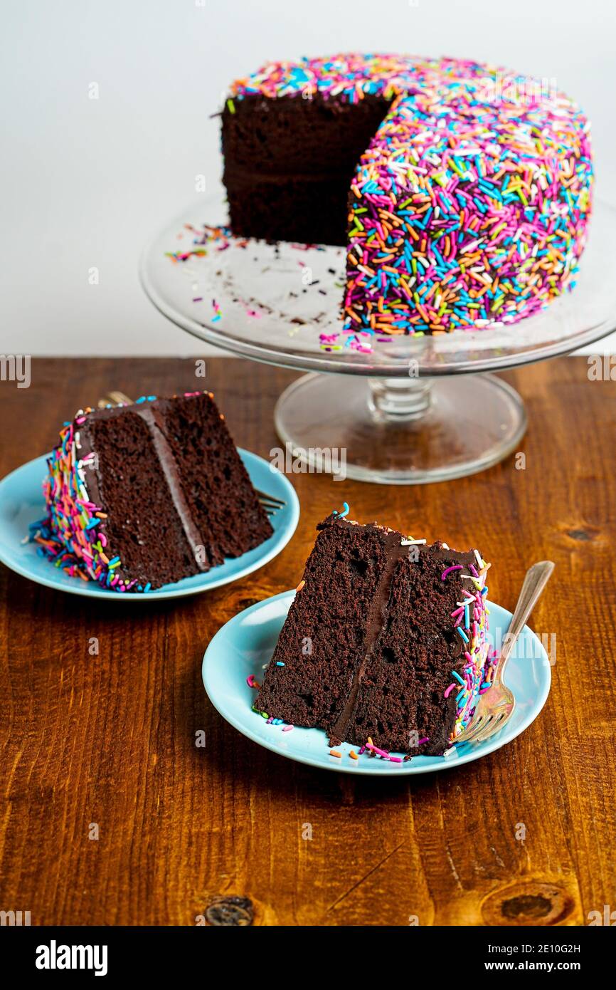 Chocolate cake with colorful sprinkles Stock Photo - Alamy