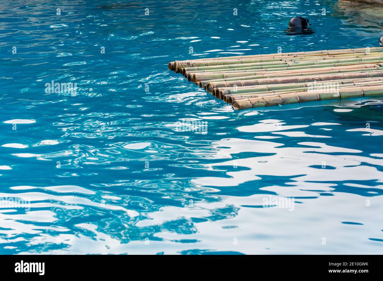 bamboo raft on blue pool Stock Photo - Alamy