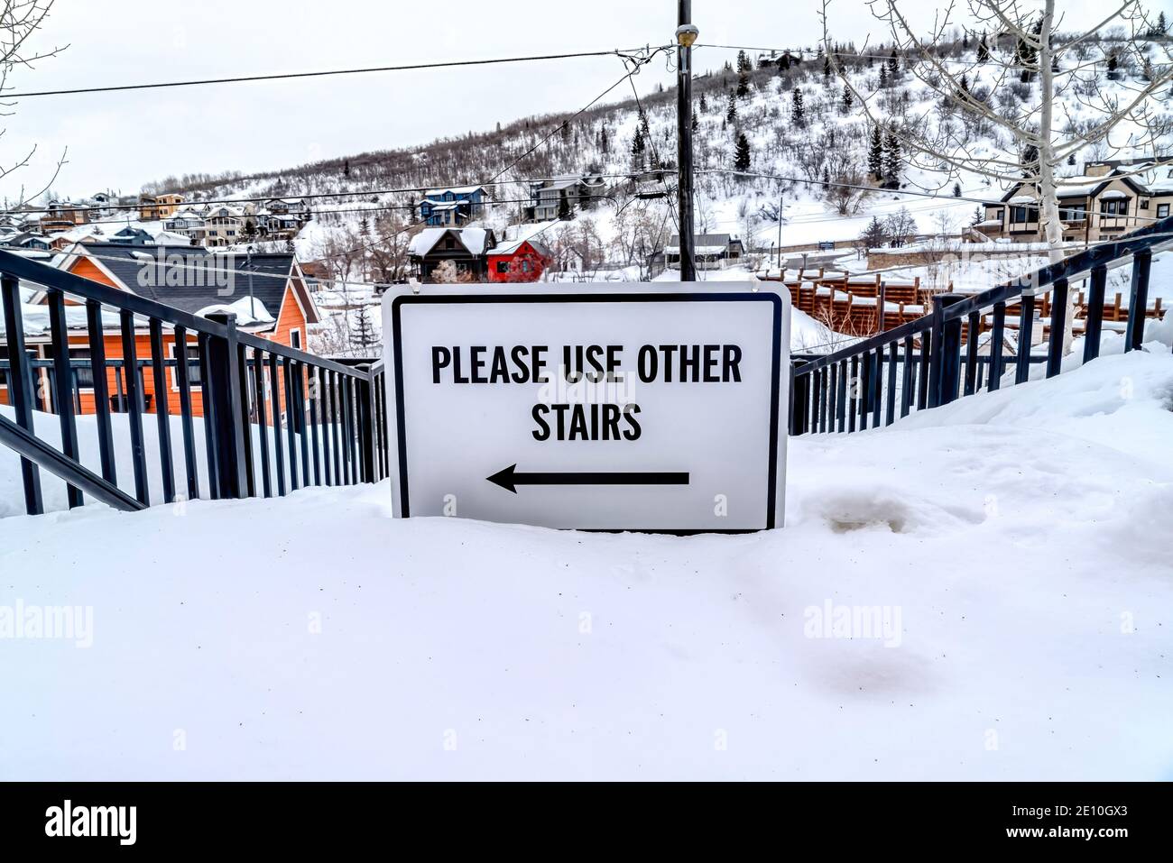 Please Use Other Stairs sign on an impassable stairway in the snowy ...