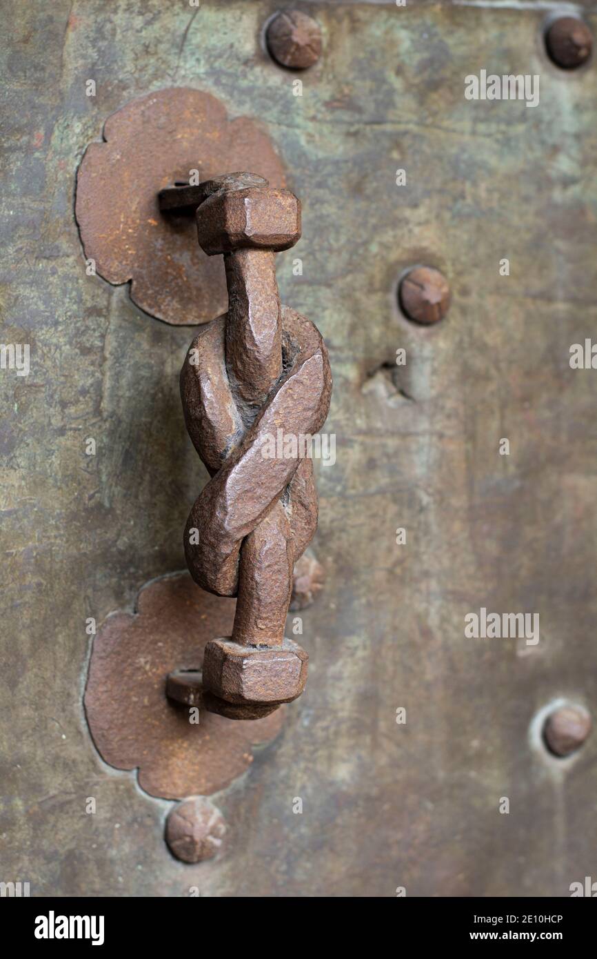 Antique medieval metal bronze door-handle Stock Photo - Alamy