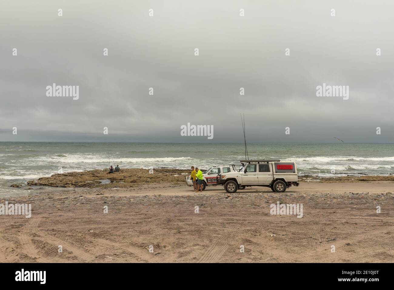 Surf fishing on the Skeleton Coast in the north of Swakopmund, Namibia ...