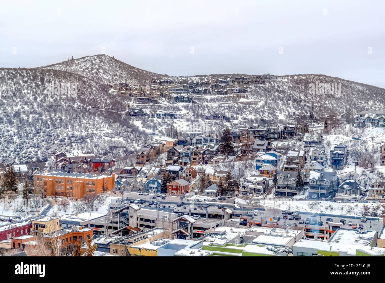 Aerial view of houses and buildings in the residential area of a snowy ...