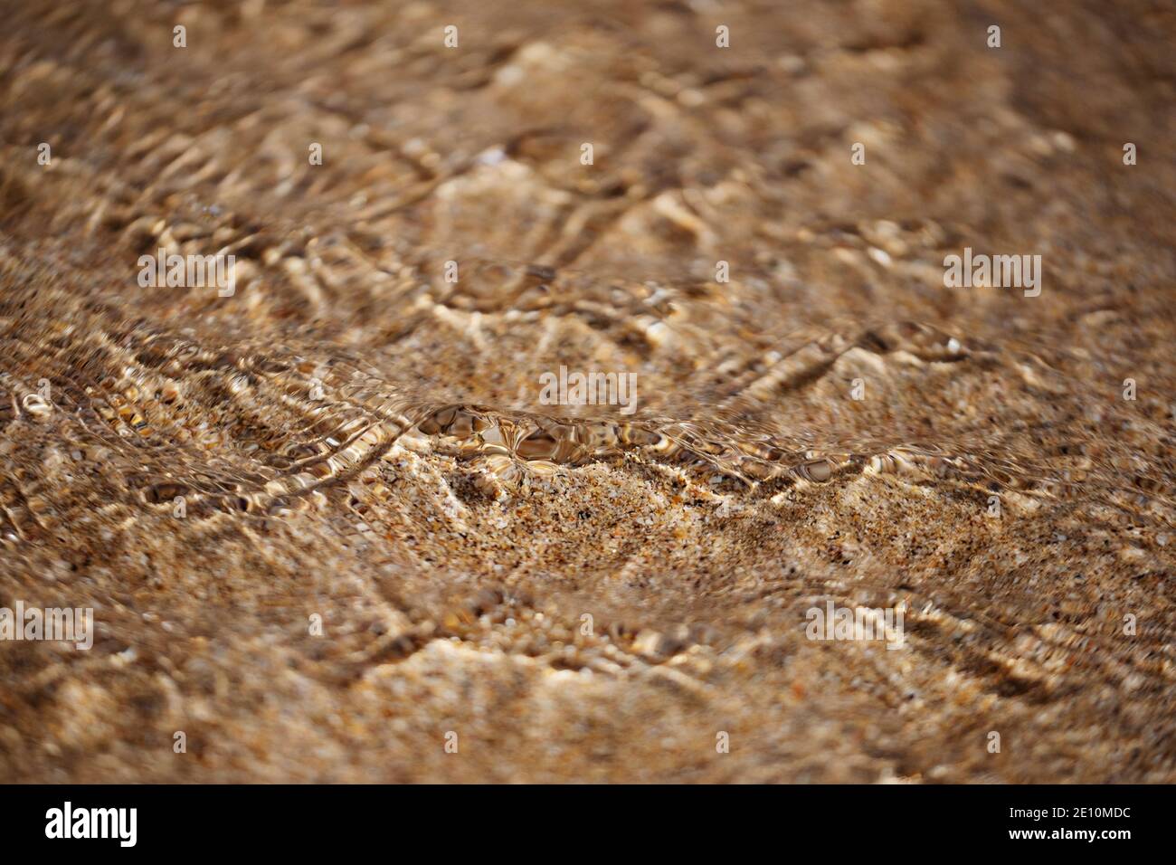 Sand patterns with water Stock Photo - Alamy