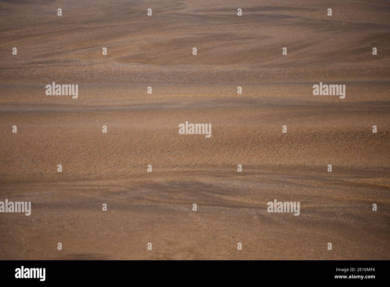 Sand patterns with water Stock Photo - Alamy