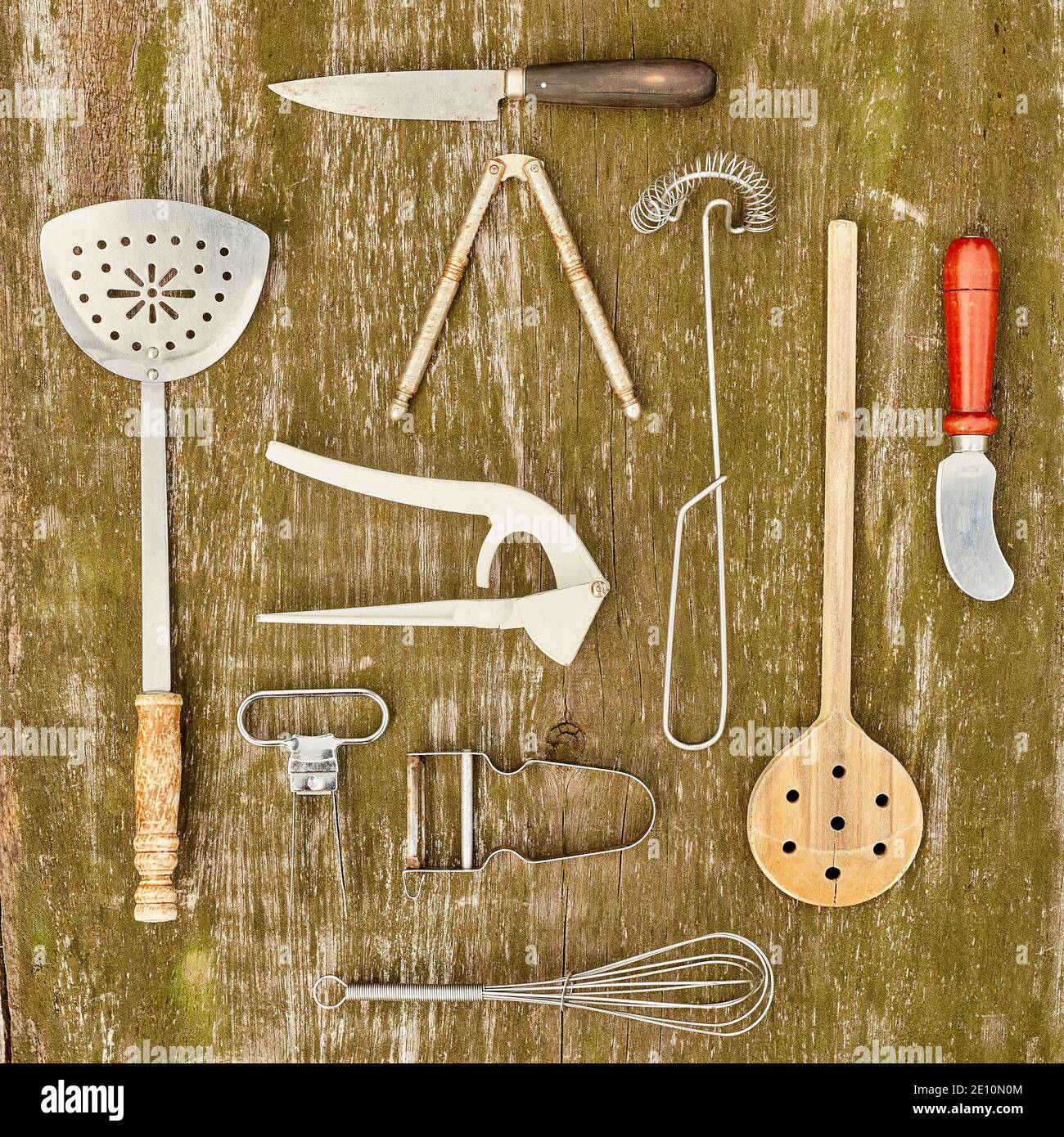Old Kitchen Implements on Wooden Surface 1 Stock Photo - Alamy