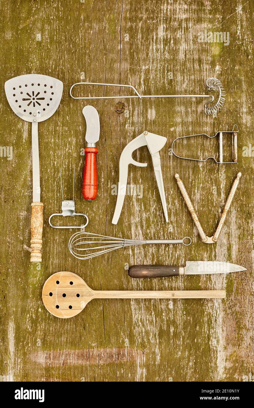 Old Kitchen Implements on Wooden Surface 2 Stock Photo - Alamy