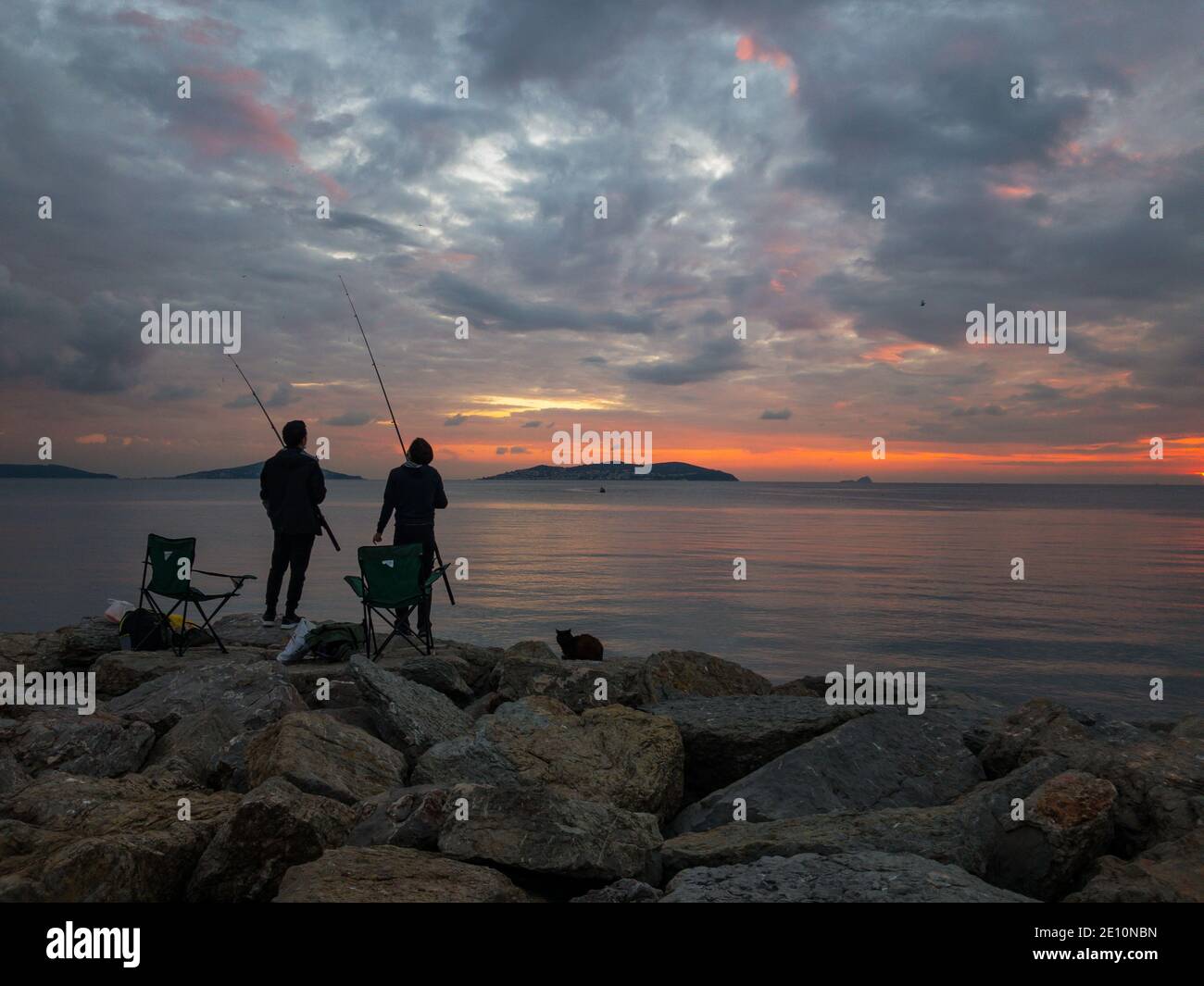 Silhouette two fishermen fishing on hi-res stock photography and images ...