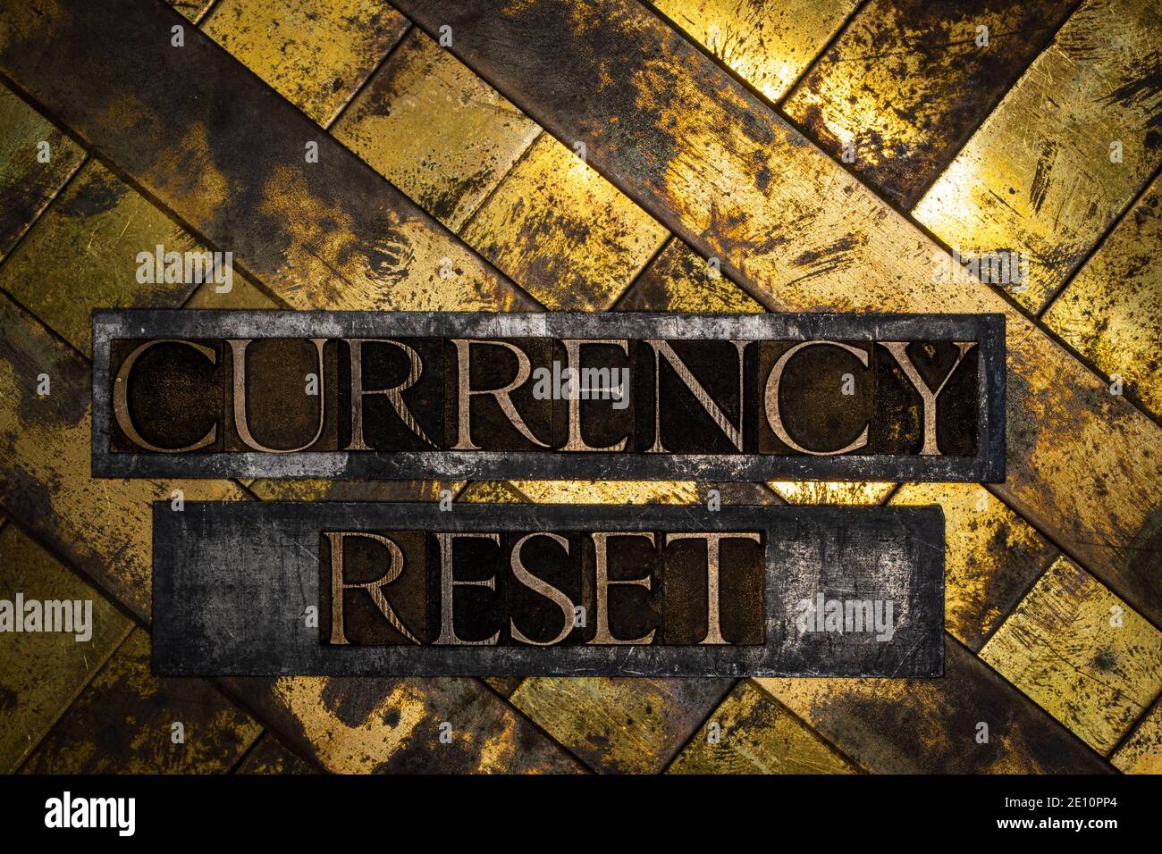 Currency Reset text message on textured grunge copper and vintage gold ...
