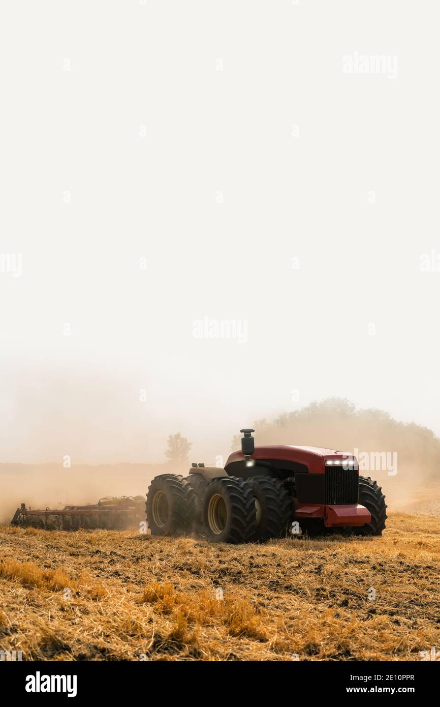 Autonomous unmanned tractor with plow working on the field. Smart ...