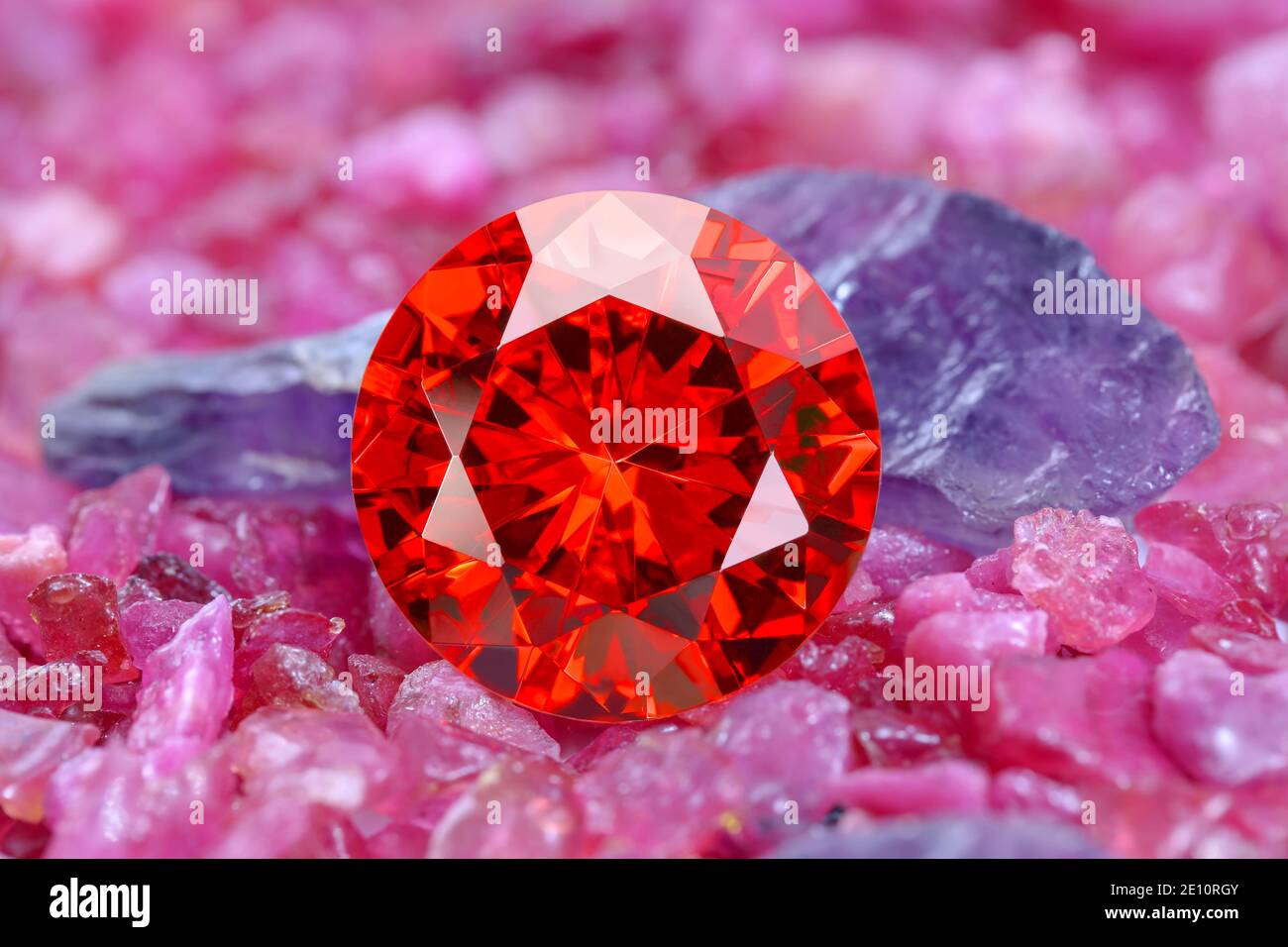 ruby red diamonds on raw ruby rough gemstone Stock Photo - Alamy