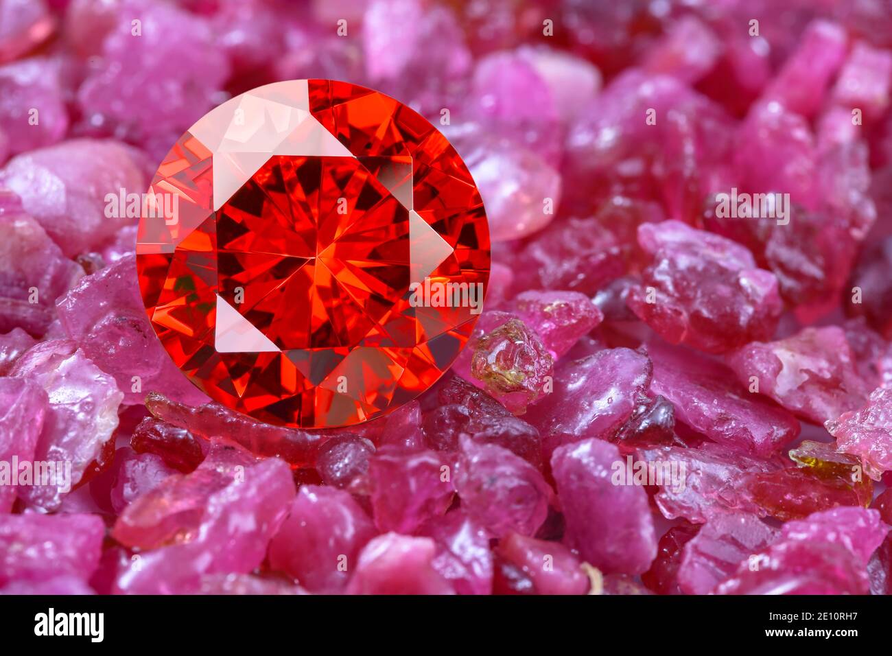 ruby red diamonds on raw ruby rough gemstone Stock Photo - Alamy