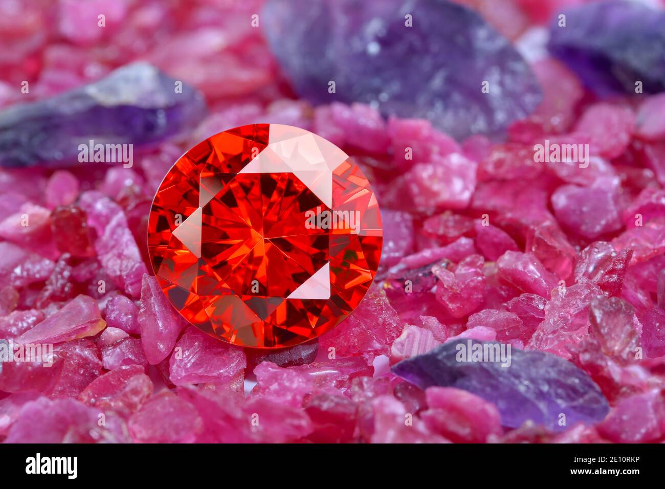 ruby red diamonds on raw ruby rough gemstone Stock Photo - Alamy