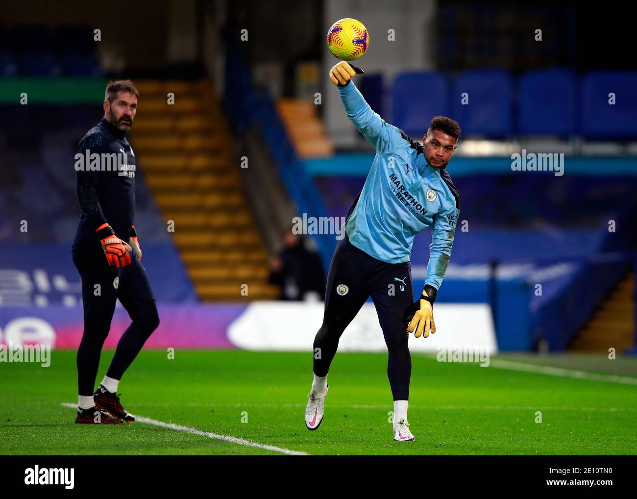 Manchester City goalkeeper Zack Steffen warms up watched by Scott ...