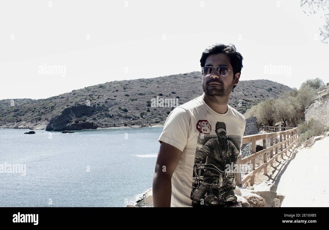 A tanned South asian Indian ethnicity man with aviator sunglasses ...