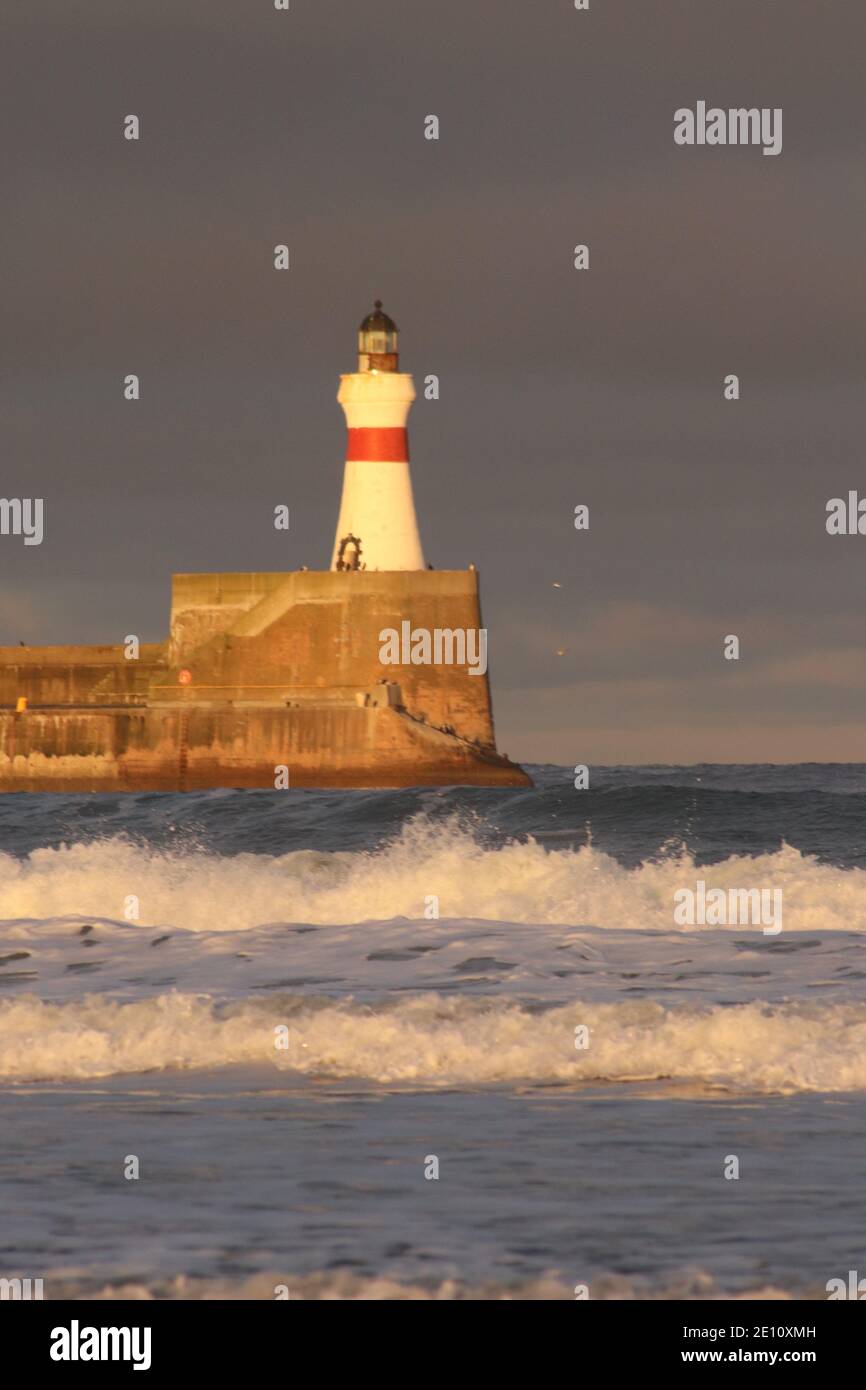 Red and white beacon on pier Stock Photo - Alamy