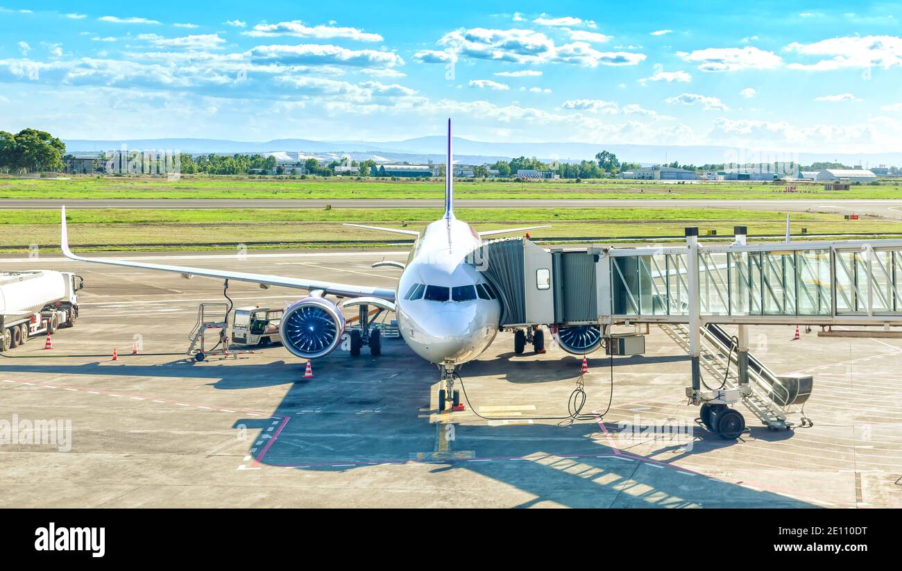 Airplane at the gate while preparing for boarding.Travel and tourist ...