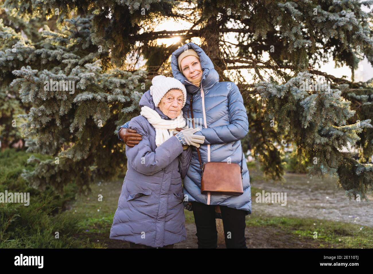 Old women hugging other on hi-res stock photography and images - Alamy