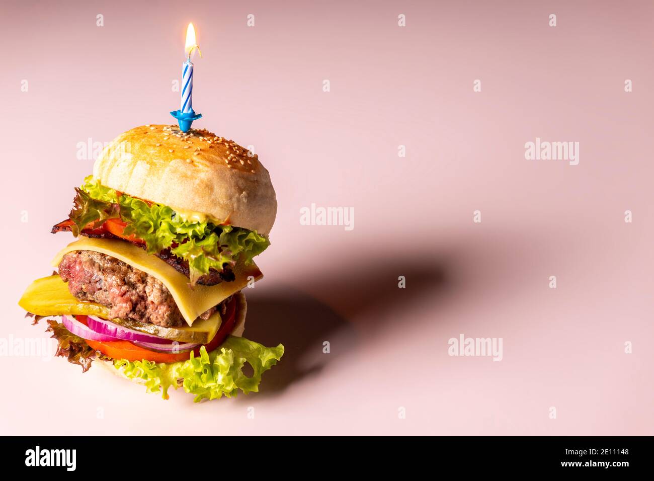 Cheeseburger With Candle Stock Photo - Alamy