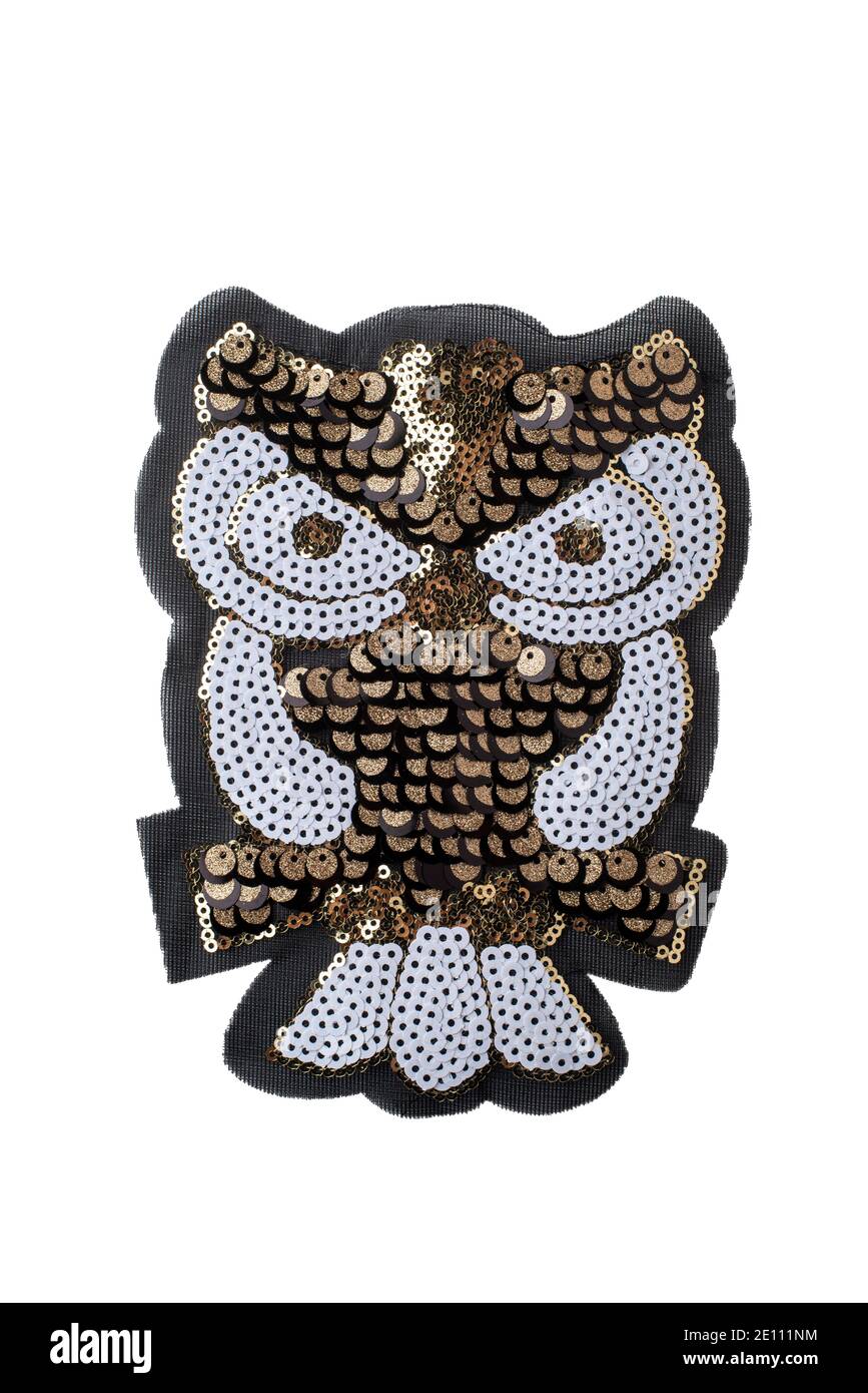 Golden sequin owl patch isolated on white background Stock Photo - Alamy