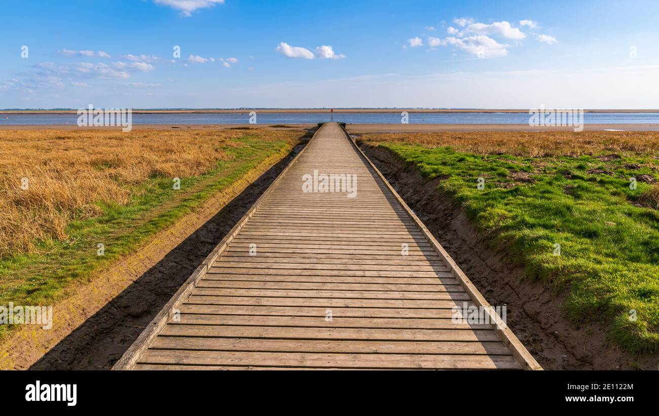 A wooden path leading to the shore of the River Ribble, seen in Lytham ...