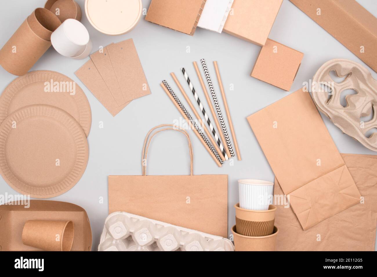 Eco-friendly tableware set - kraft paper food packaging on light grey ...