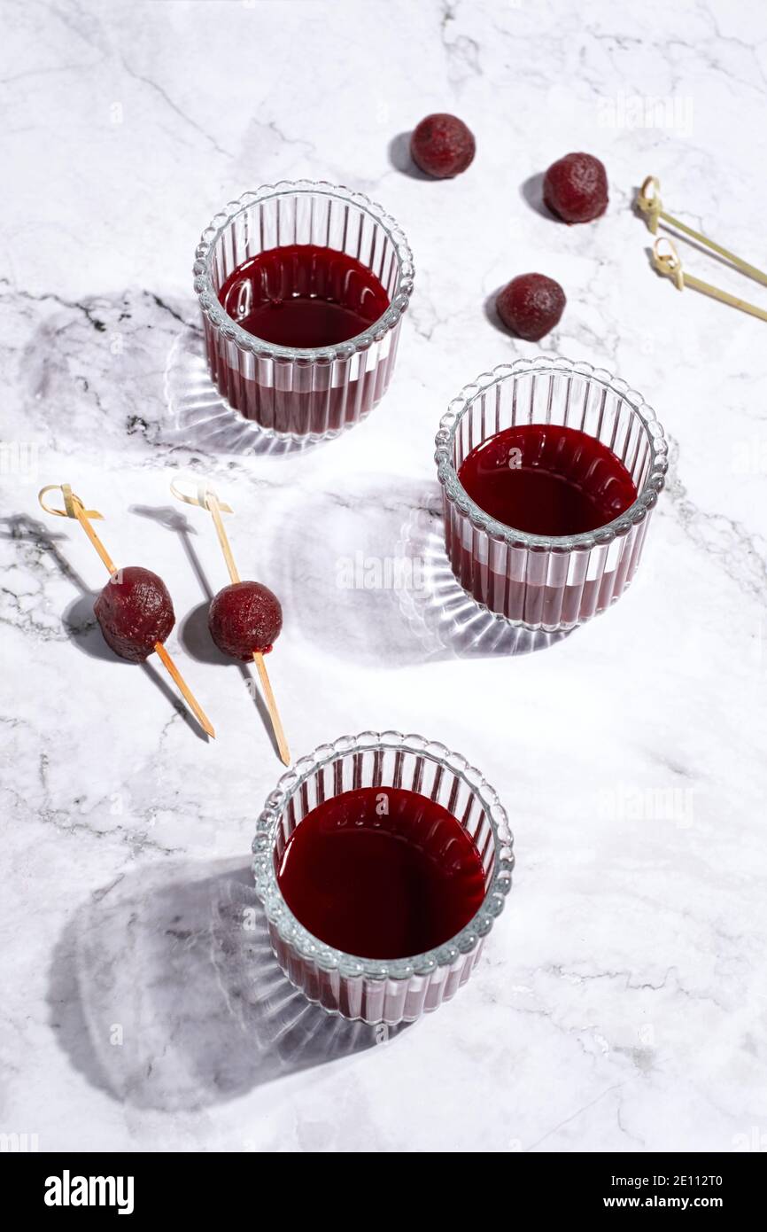 Homemade red beet juice beautifully arranged in three glasses on a ...