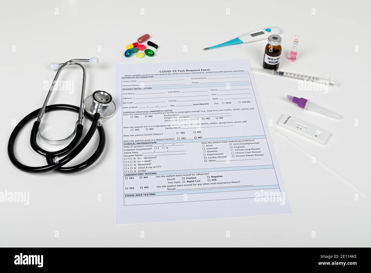 Close up picture of medical paperwork and tools on white background ...