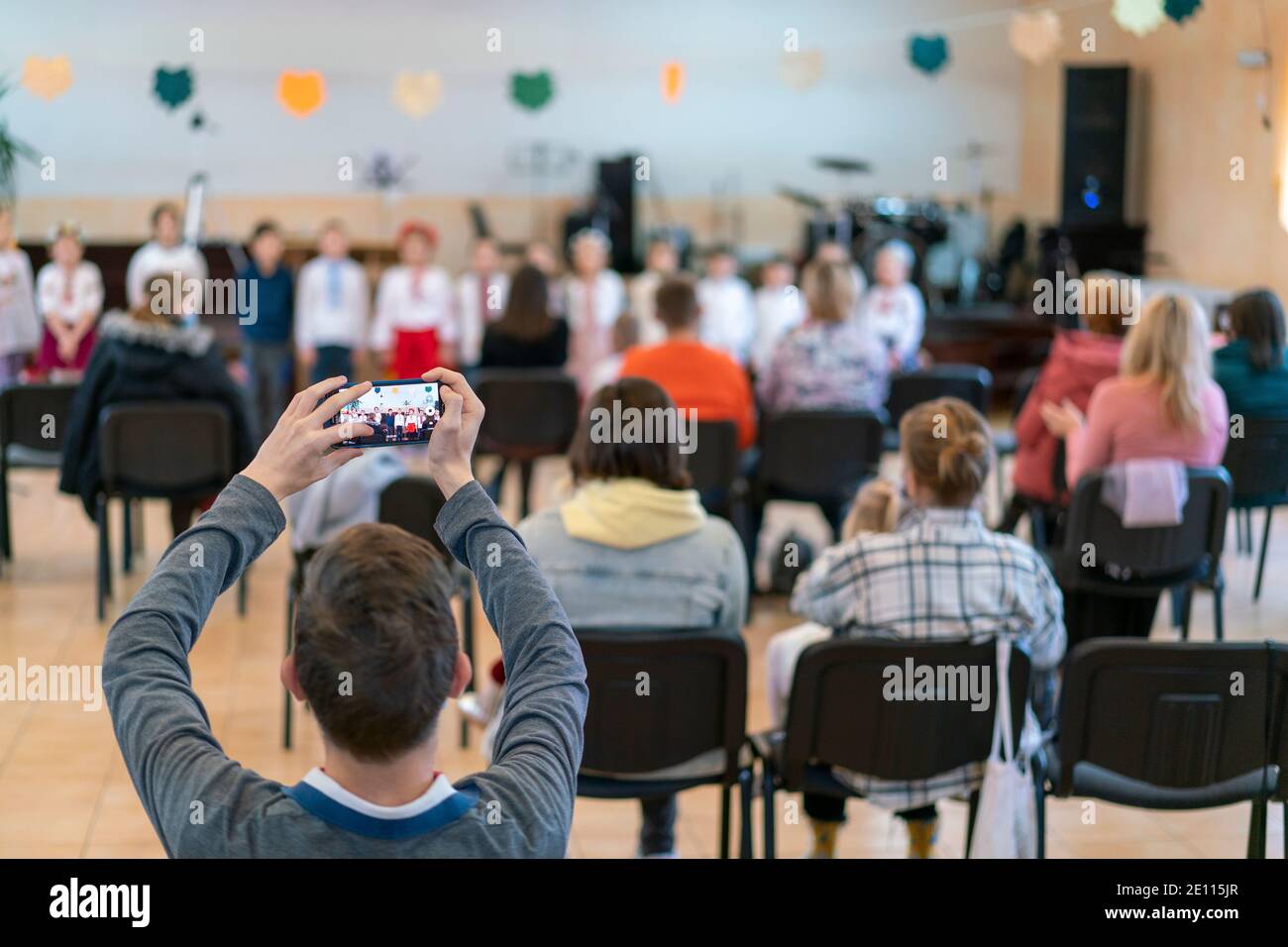 Parents at the performance of children in kindergarten or school ...