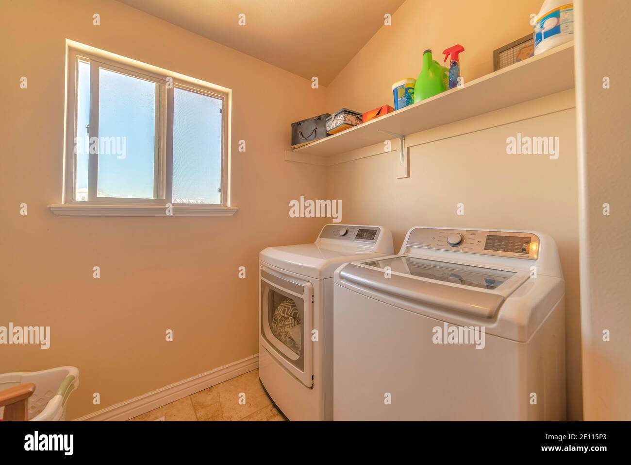 Washing machine and clothes dryer inside the laundry room of ...
