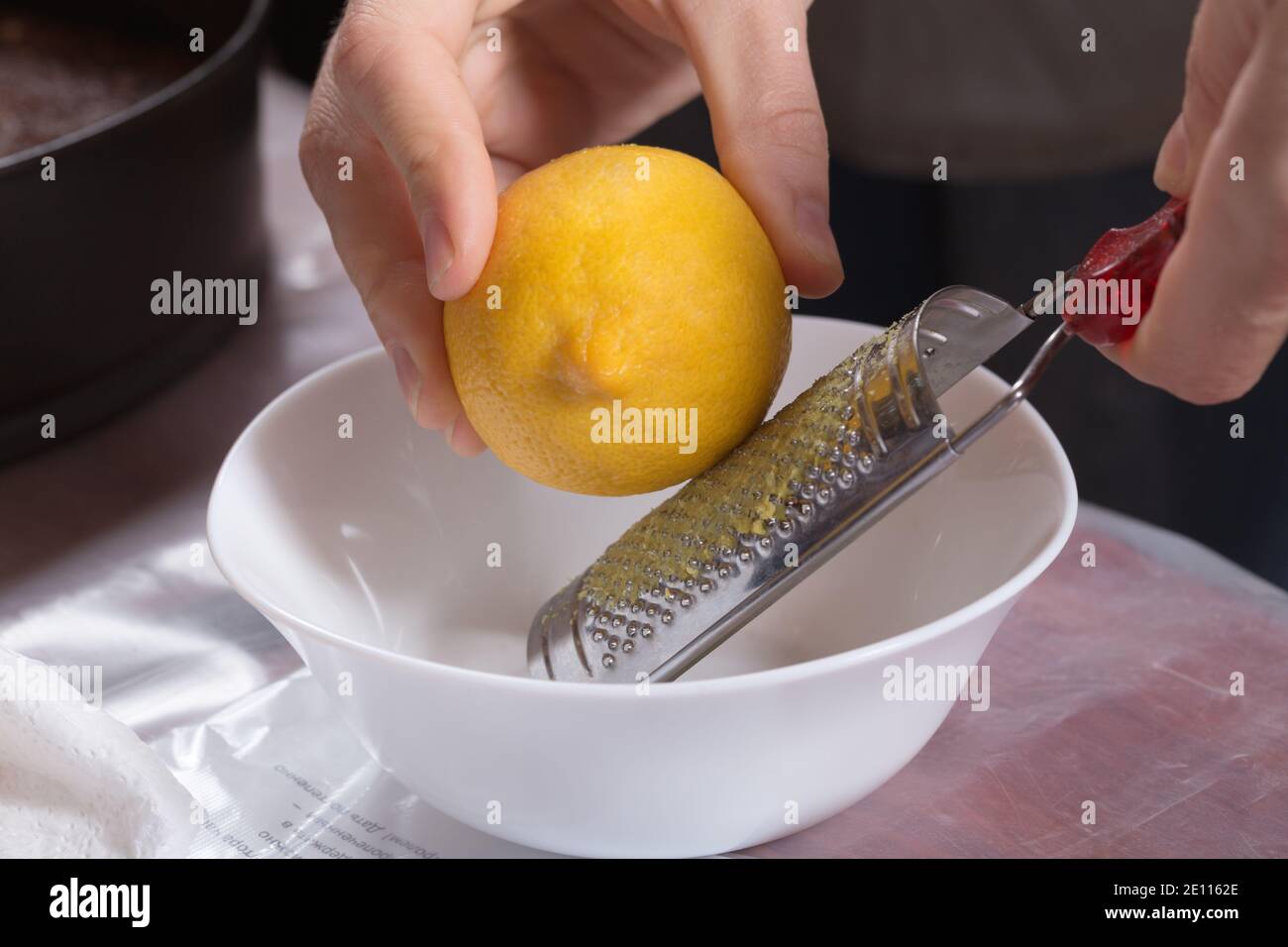 Master class on the process of making lemon zest. Close-up Stock Photo ...