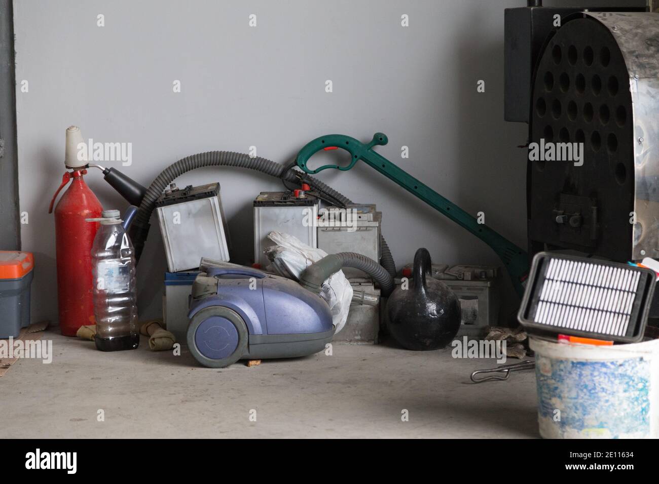 Messy storage room in garage for junk in old house Stock Photo - Alamy