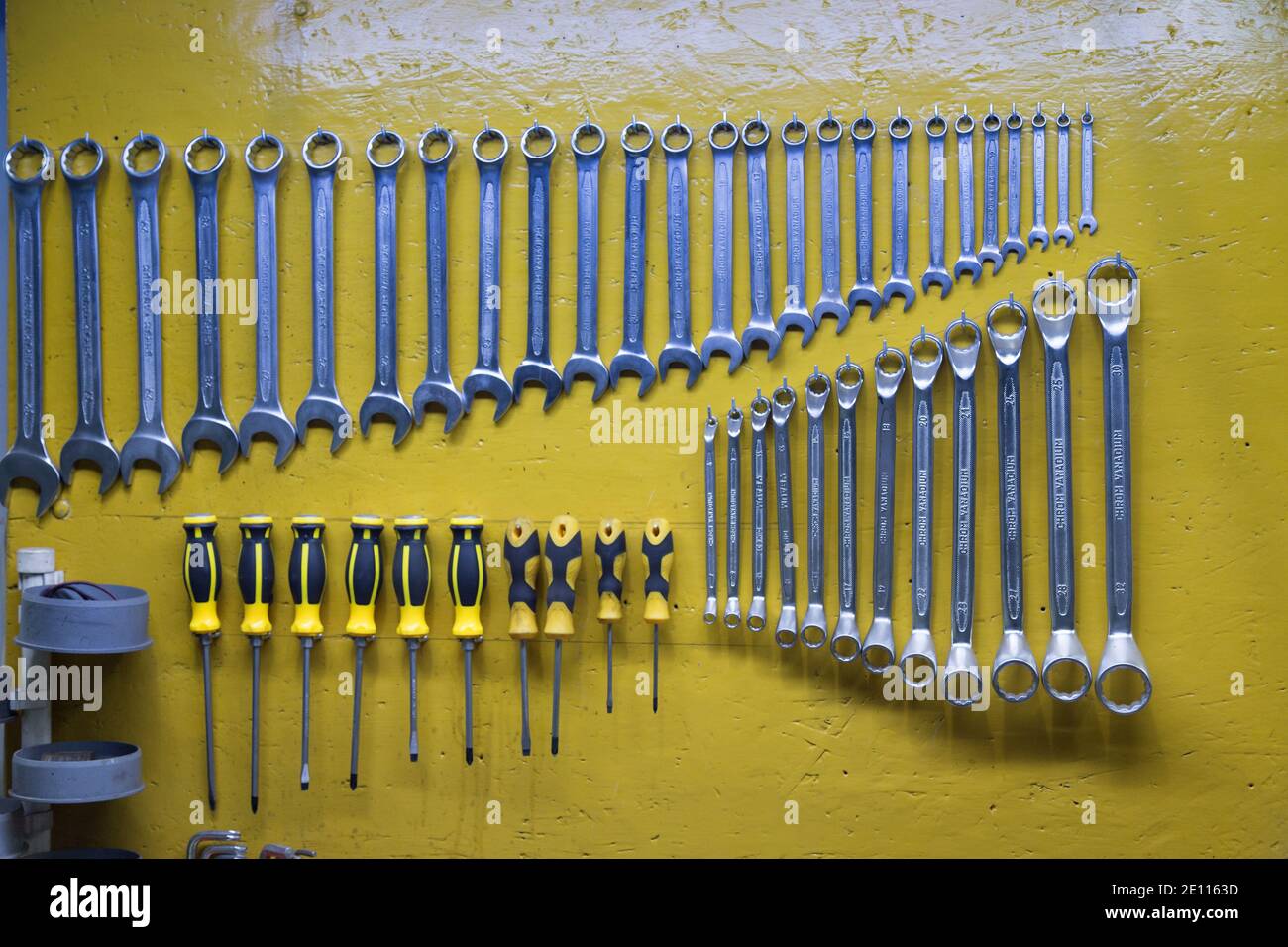 Arrangement of tools on the wall in the workshop. Close-up Stock Photo ...
